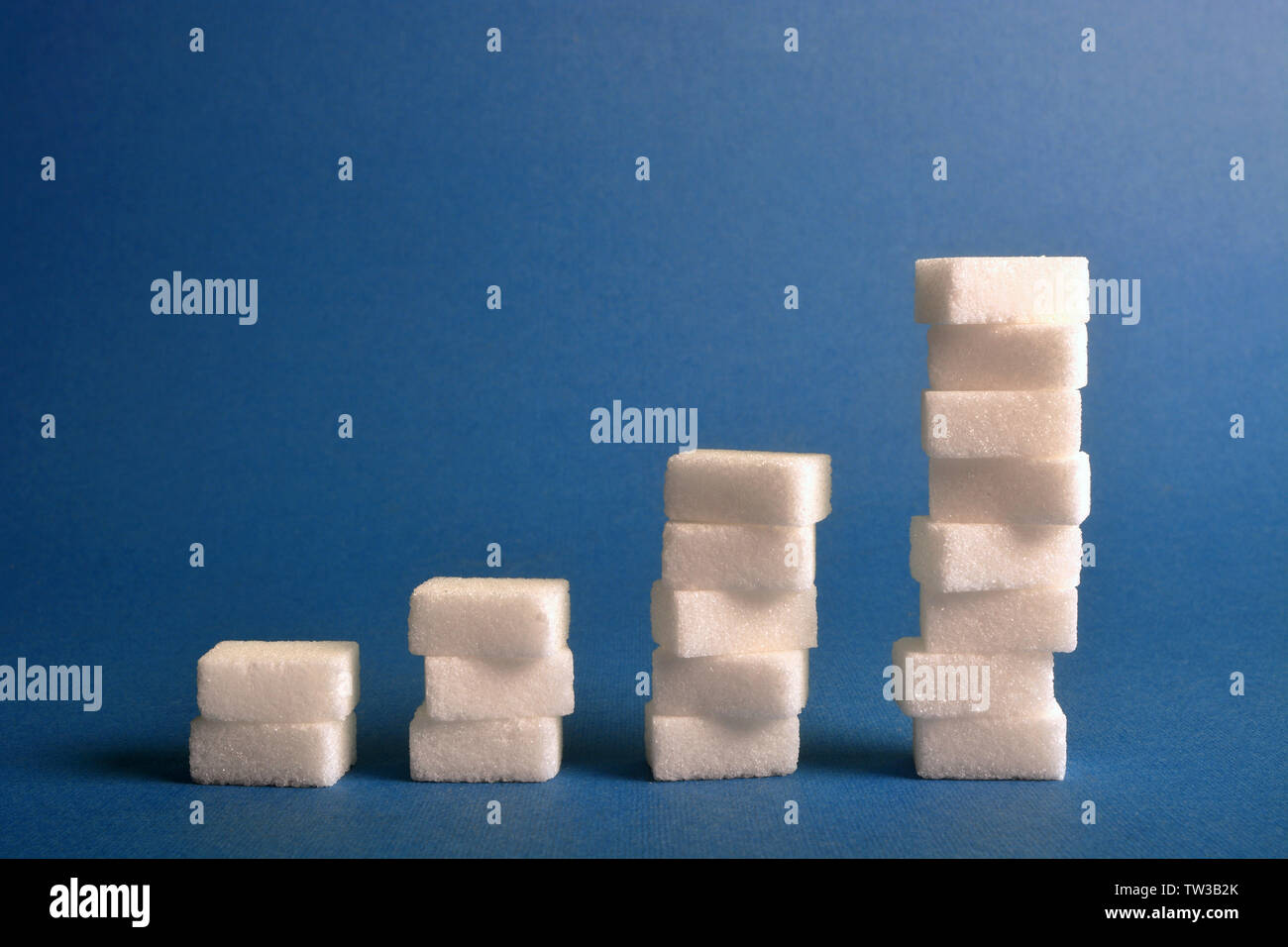 Stacks of sugar cubes in the shape of a diagram Stock Photo - Alamy