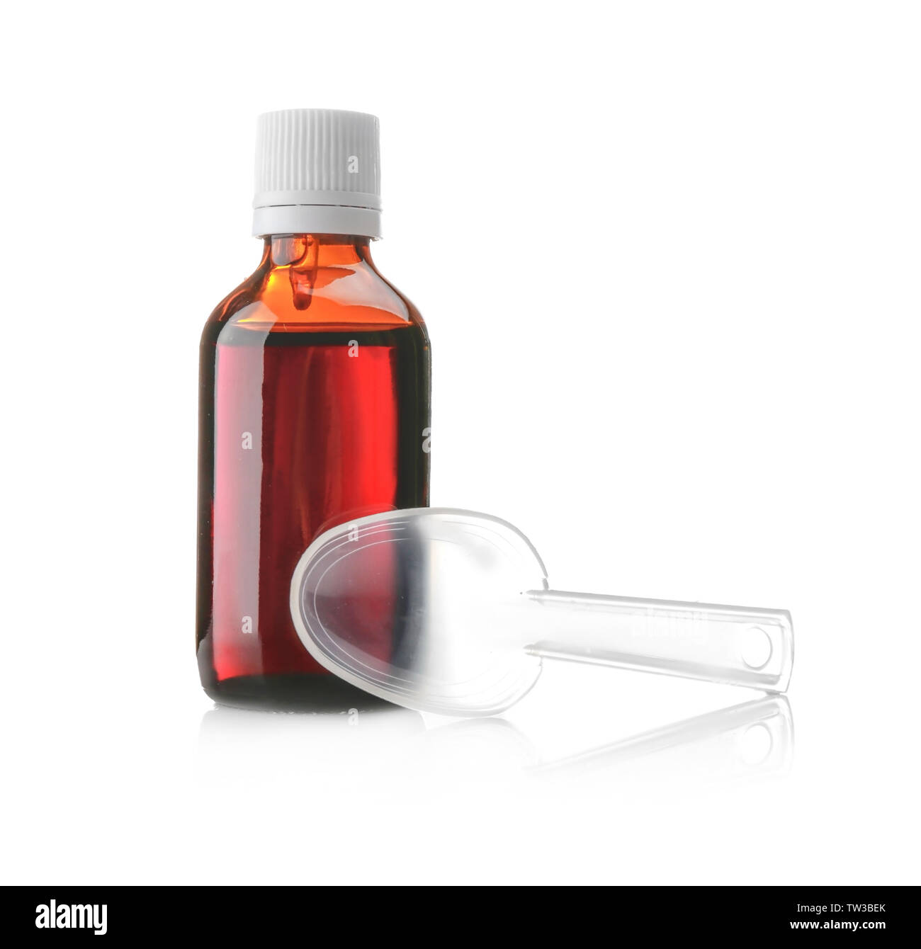 Bottle with cough syrup and measuring spoon on white background Stock ...