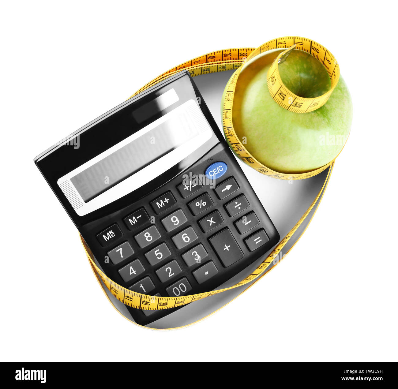 Weight loss concept. Apple, calculator and measuring tape on white ...