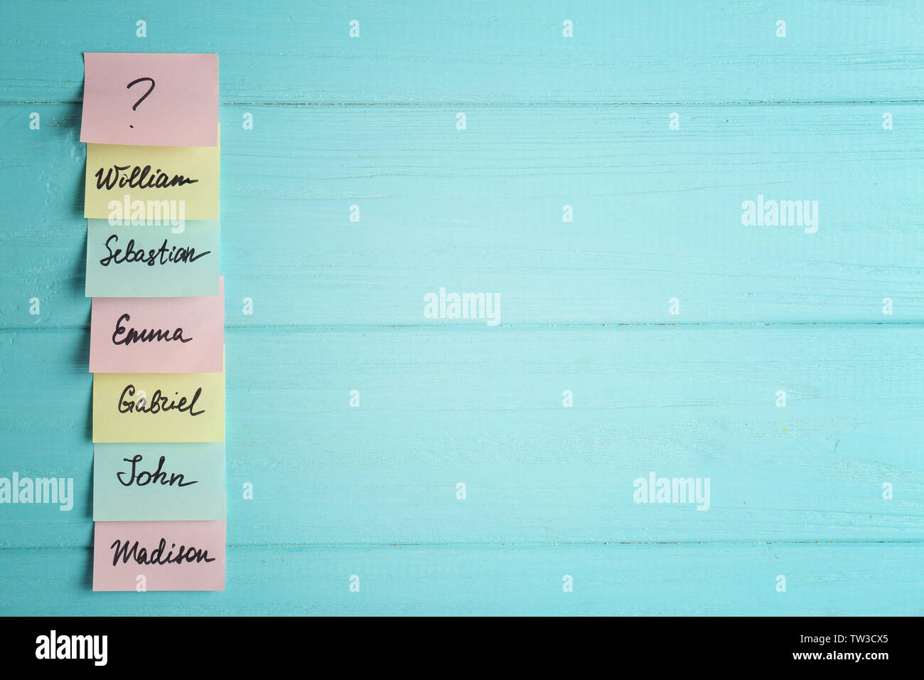 Paper stickers with different names on wooden background. Concept of ...