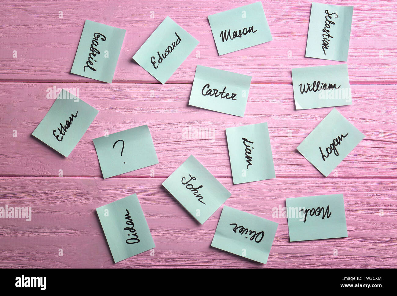 Paper stickers with different names on wooden background. Concept of ...