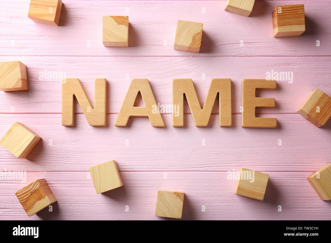 Word NAME and wooden cubes on color background. Concept of choosing ...
