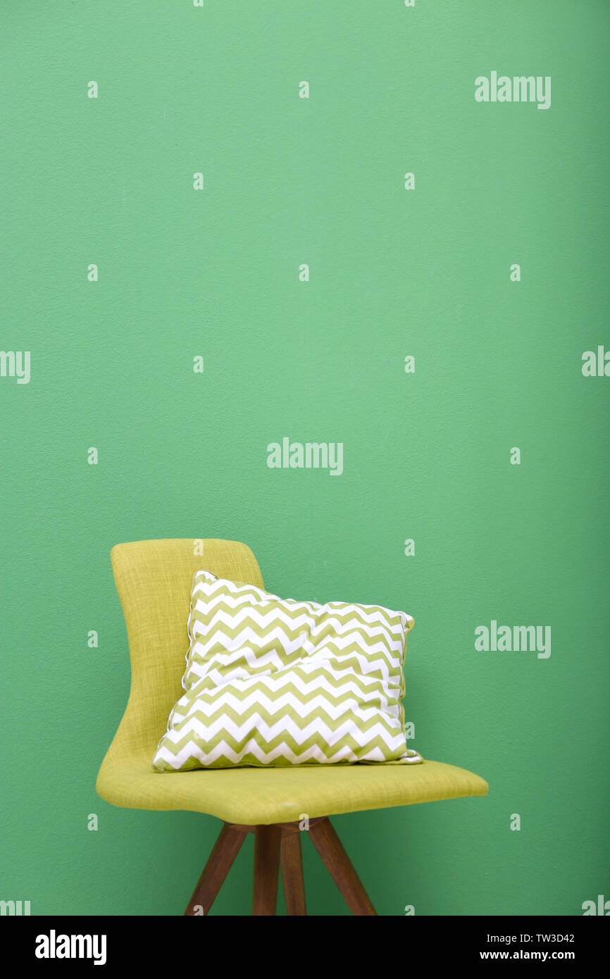 Cozy chair on green background Stock Photo - Alamy