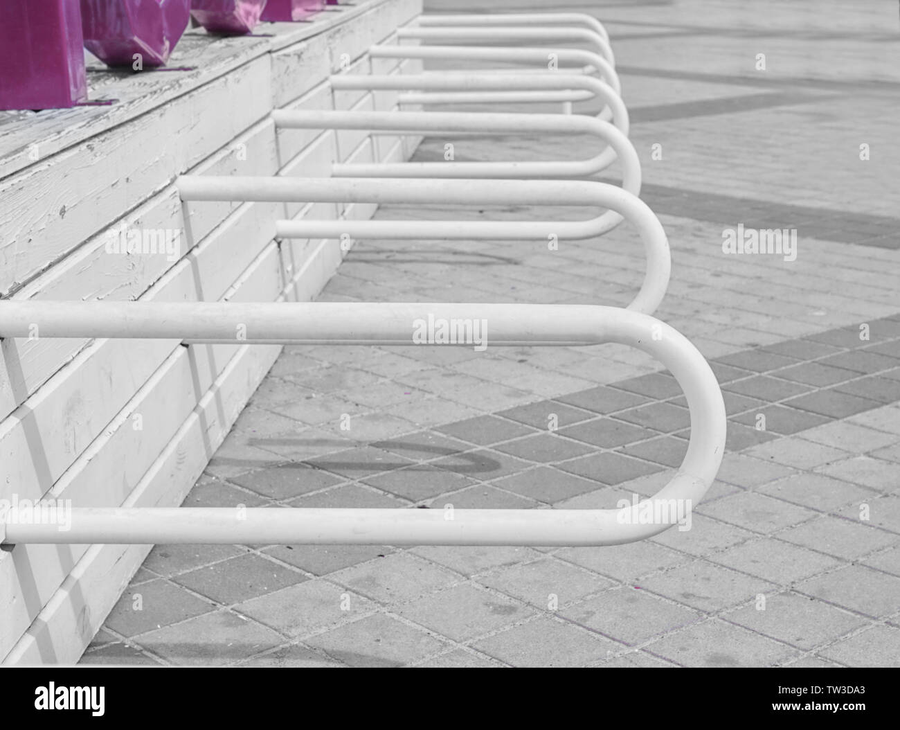 Empty bicycle rack on sidewalk Stock Photo - Alamy