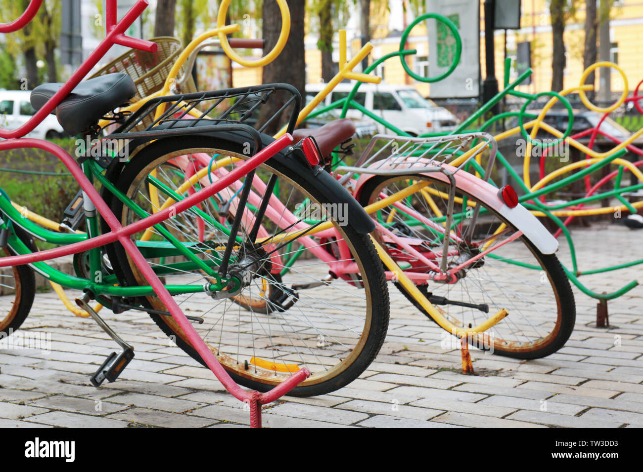 Colorful bicycle rack with bikes in park Stock Photo - Alamy