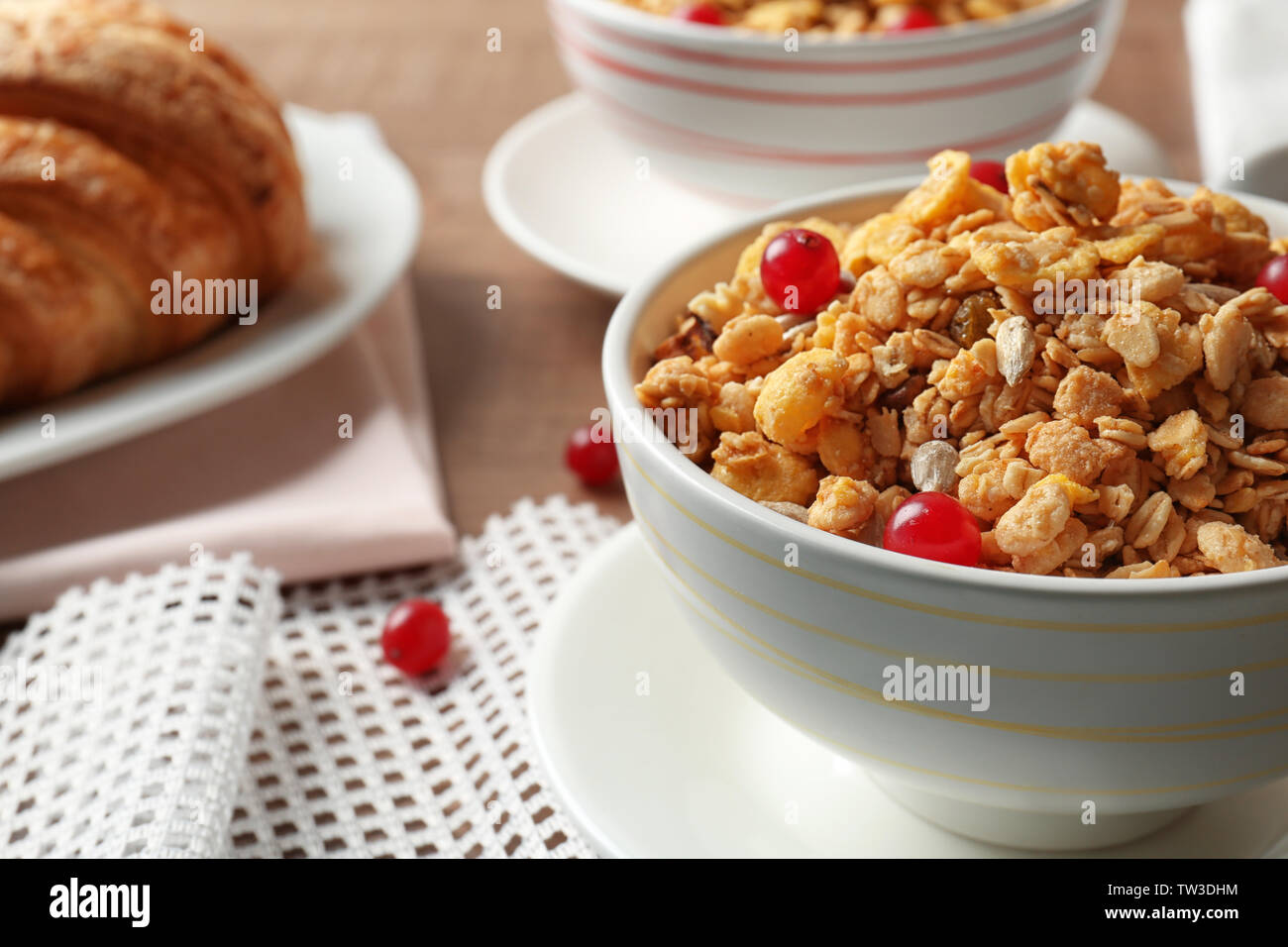 Breakfast cereal with cranberries and sunflower seeds on table Stock ...
