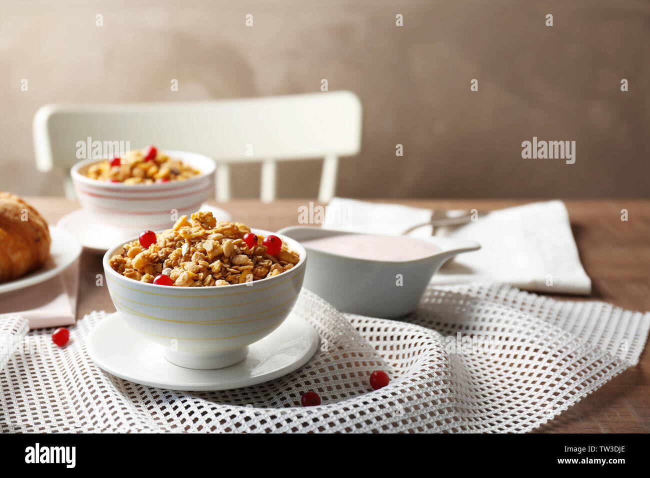 Breakfast cereal with cranberries and sunflower seeds on table Stock ...