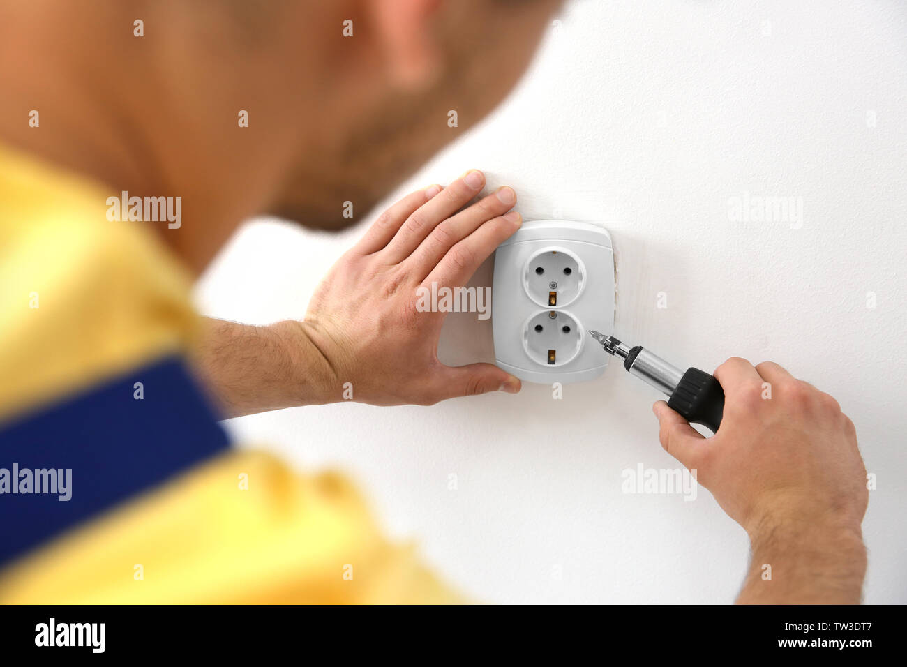 Person repairing electrical socket hi-res stock photography and images ...