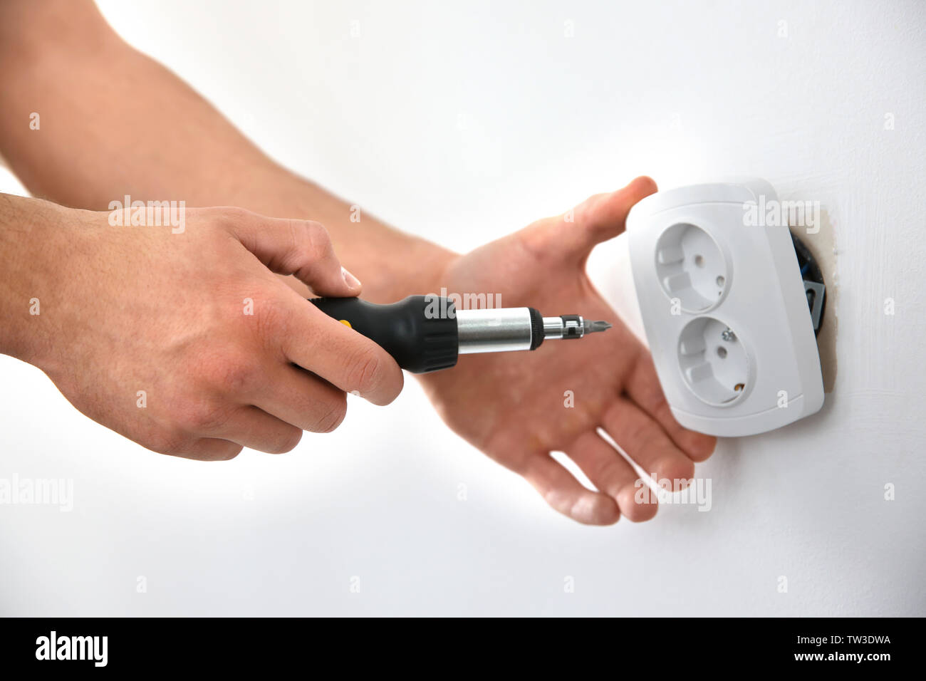Person repairing electrical socket hi-res stock photography and images ...