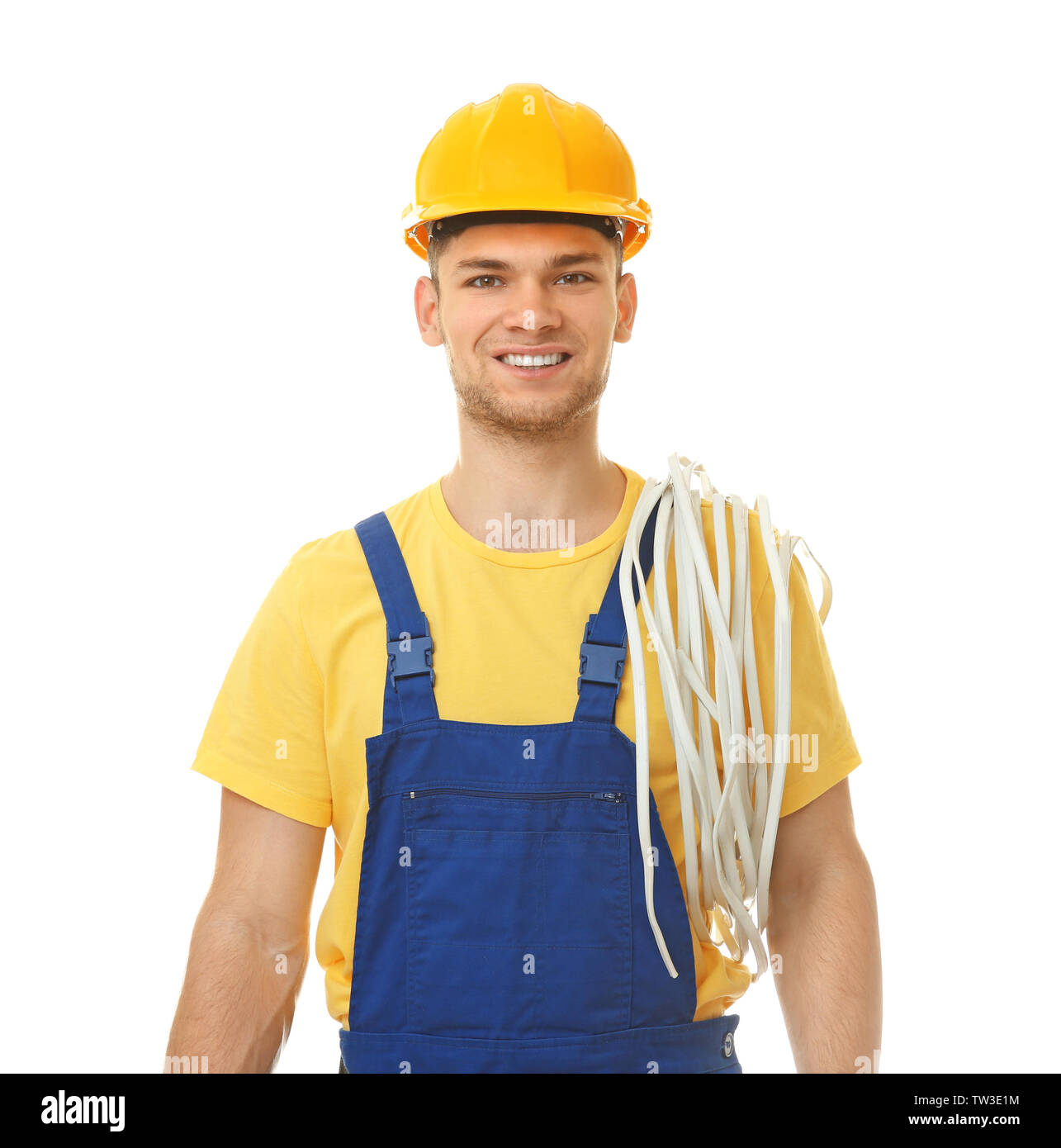 Young smiling electrician with bunch of wires on white background Stock ...