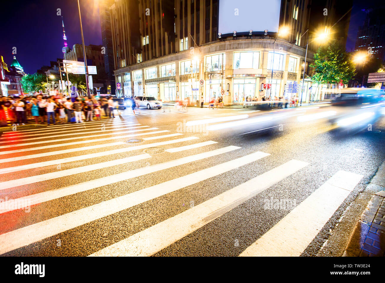 crowded road with zebra crossing and gymnasium Stock Photo - Alamy