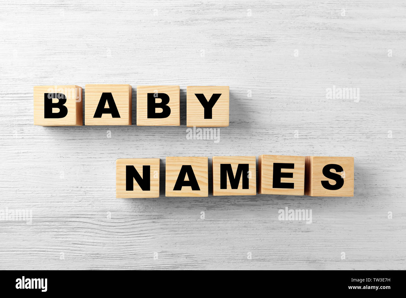 Cubes with words BABY NAMES on wooden background Stock Photo - Alamy
