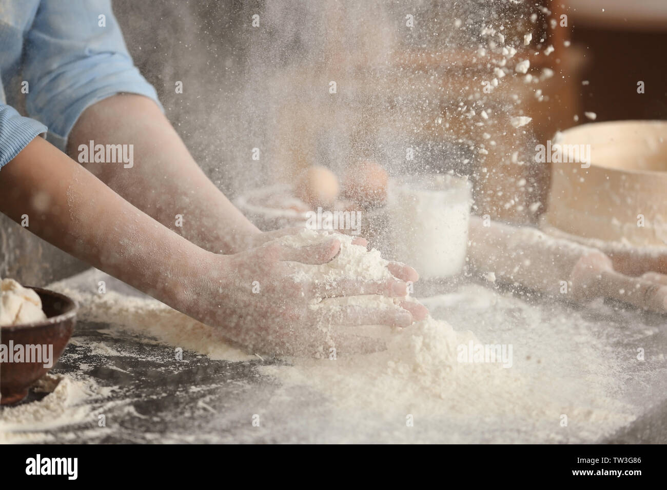 Kitchen chef sprinkling flour on hi-res stock photography and images ...