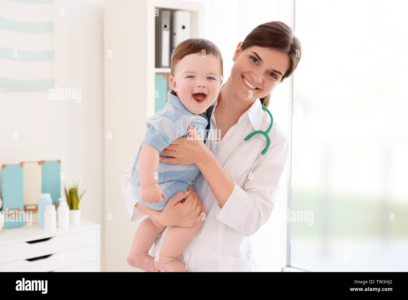 Female doctor and cute little baby in clinic. Baby health concept Stock ...