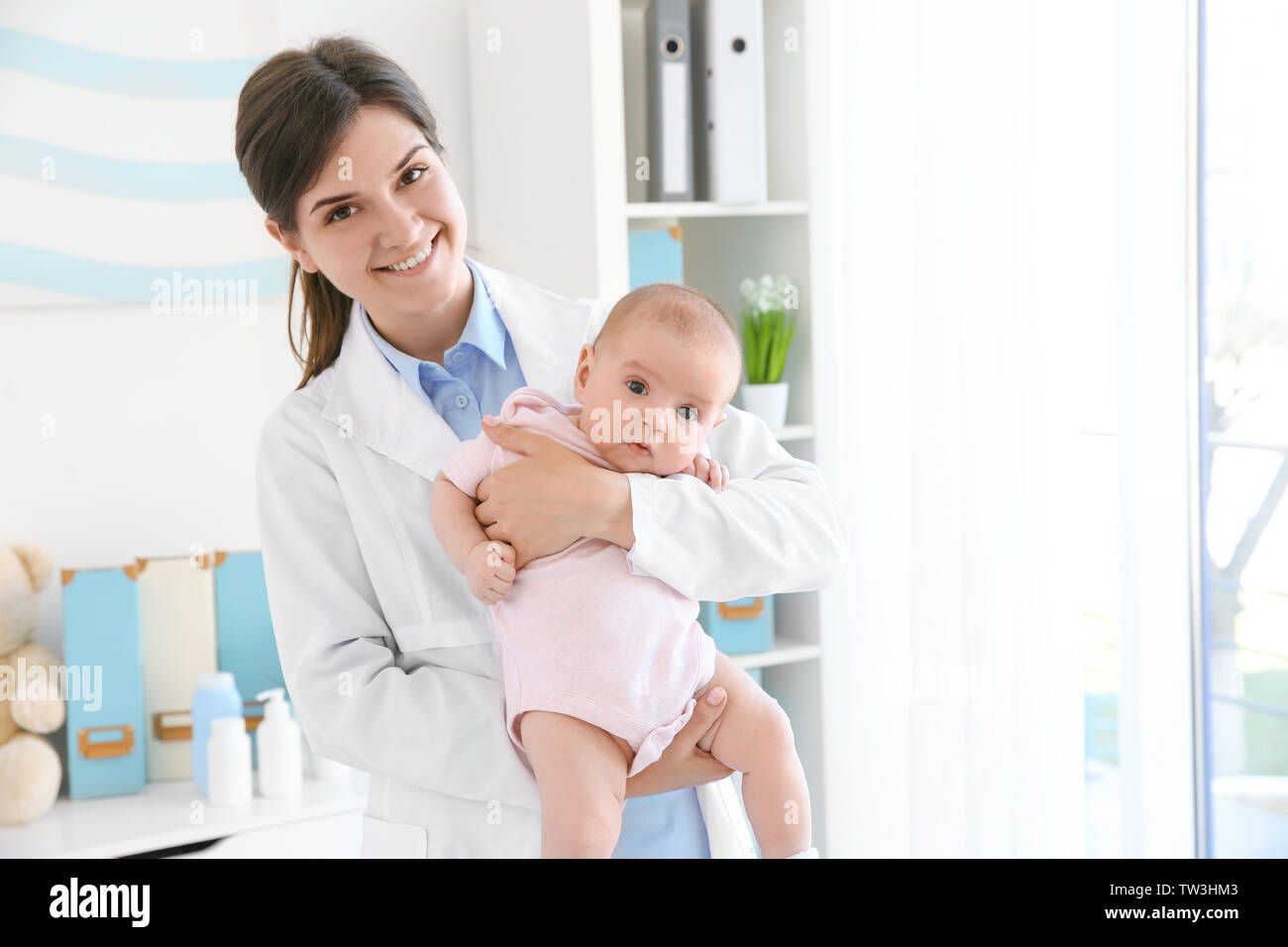 Female doctor and cute little baby in clinic. Baby health concept Stock ...