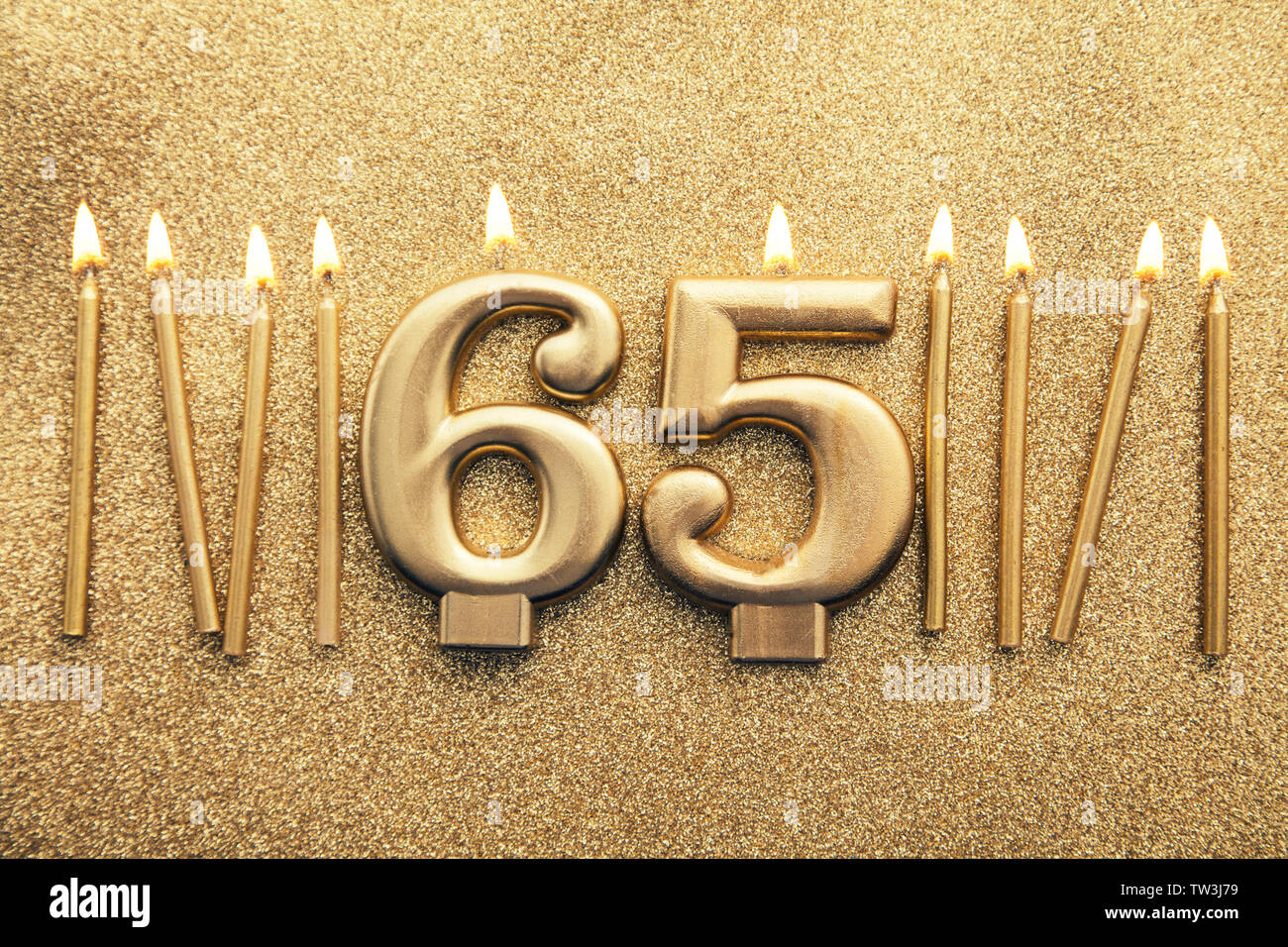 Number 65 gold celebration candle on a glitter background Stock Photo ...