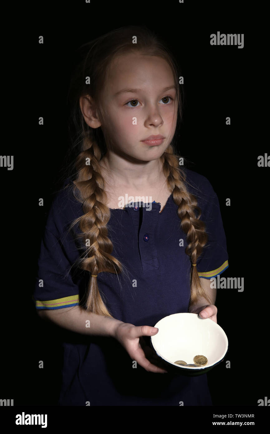 Girl beggar holding bowl hi-res stock photography and images - Alamy