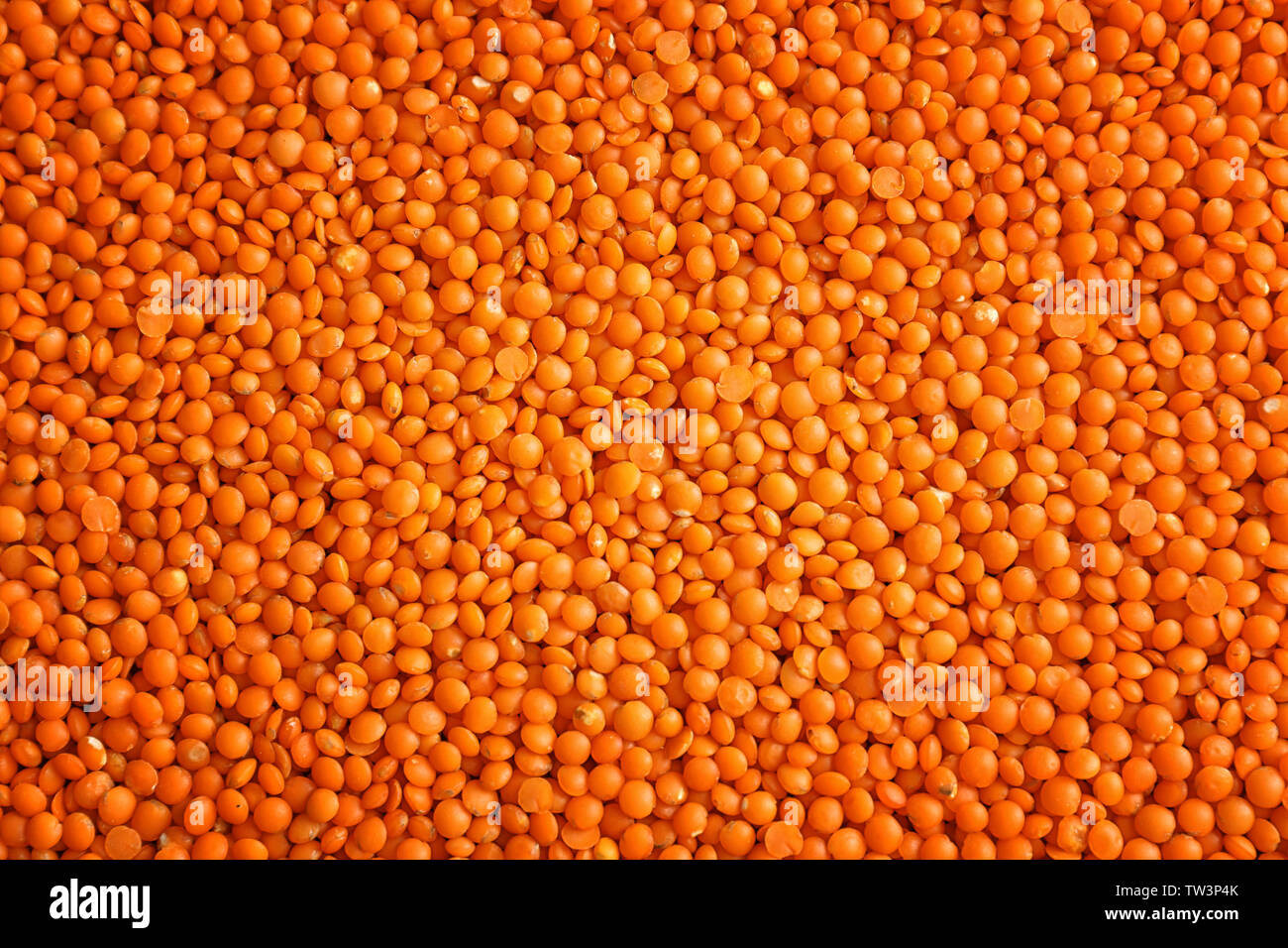 Red lentils background Stock Photo - Alamy