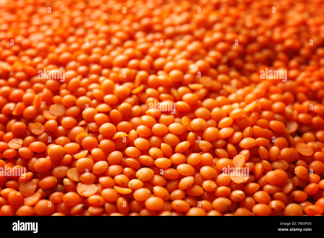 Red lentils background Stock Photo - Alamy