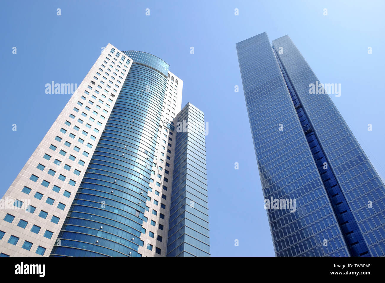 Tall houses on blue sky background Stock Photo - Alamy