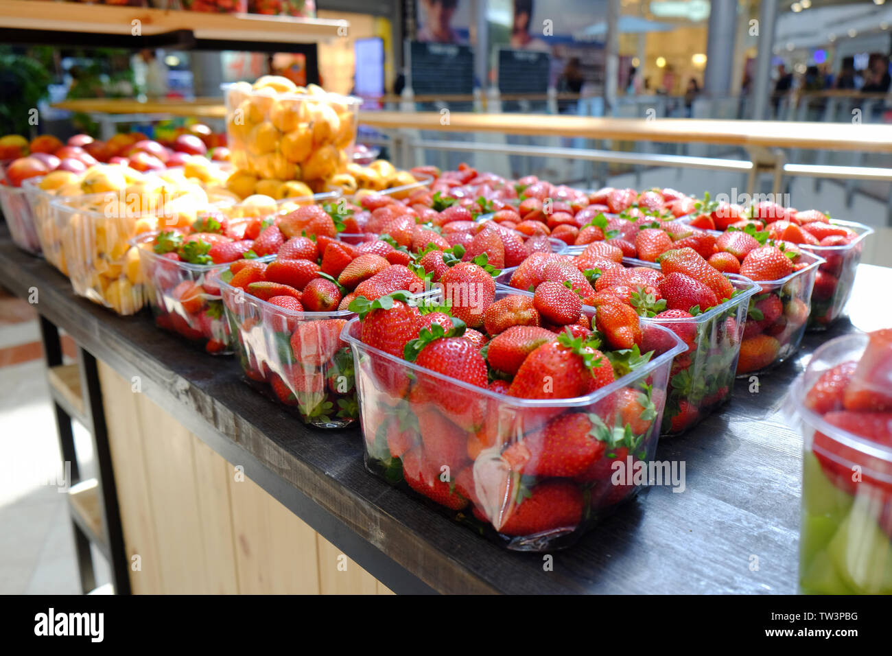 Different fruits on a shop counter Stock Photo - Alamy