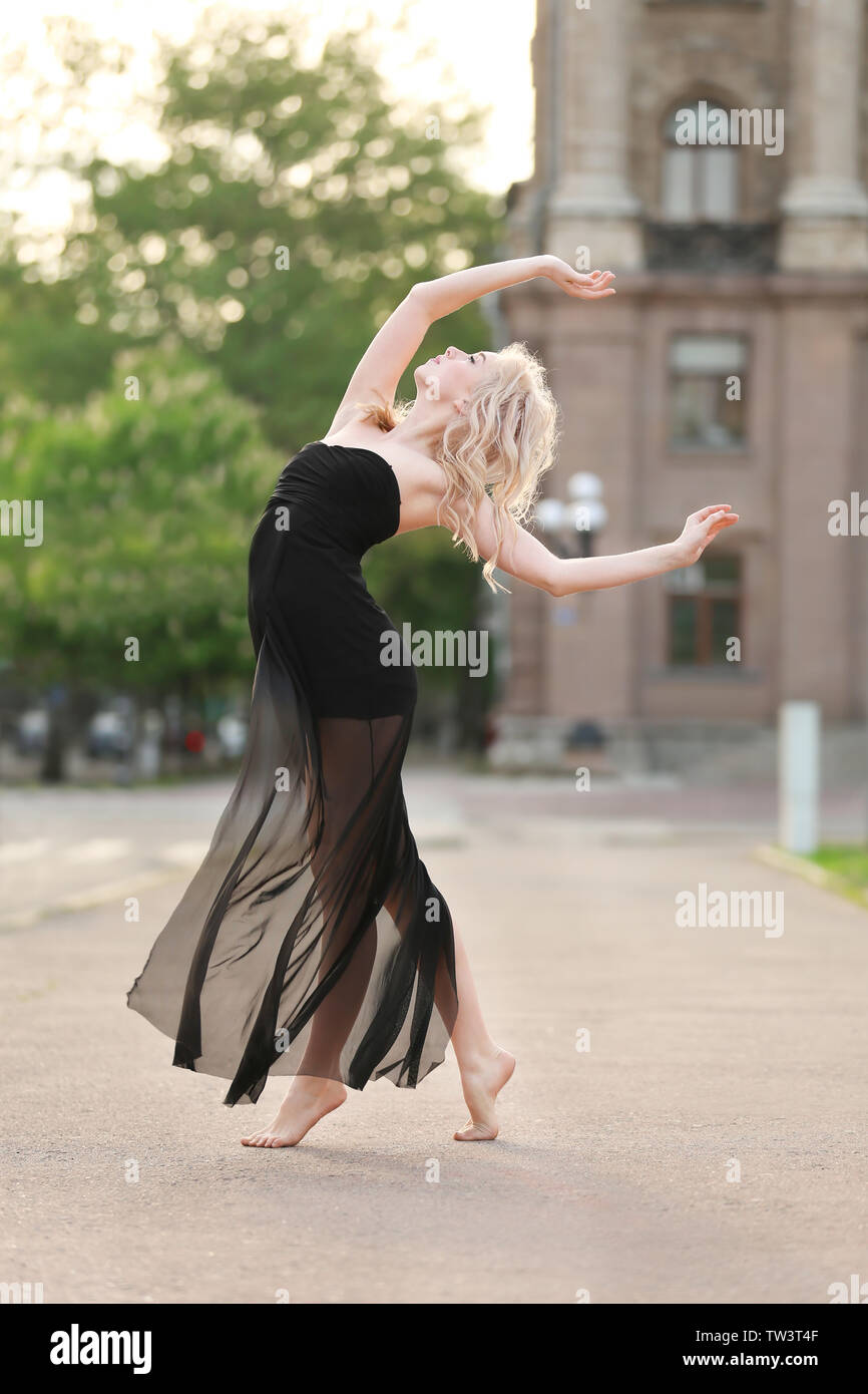 Beautiful passionate woman dancing in street Stock Photo - Alamy