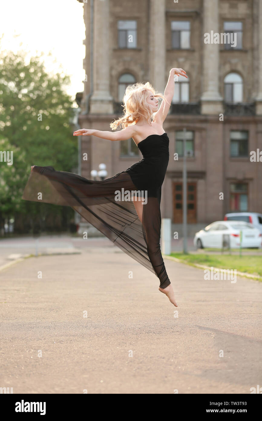 Beautiful passionate woman dancing in street Stock Photo - Alamy