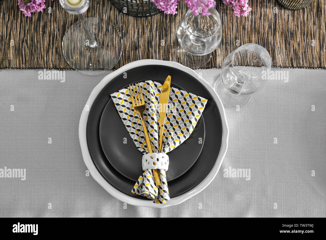 Beautiful table setting with golden cutlery Stock Photo - Alamy