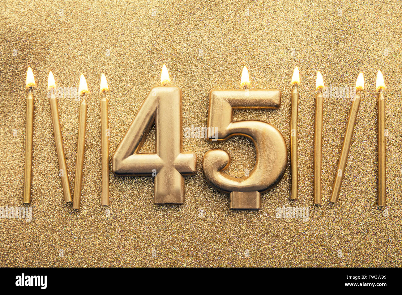 Number 45 gold celebration candle on a glitter background Stock Photo ...