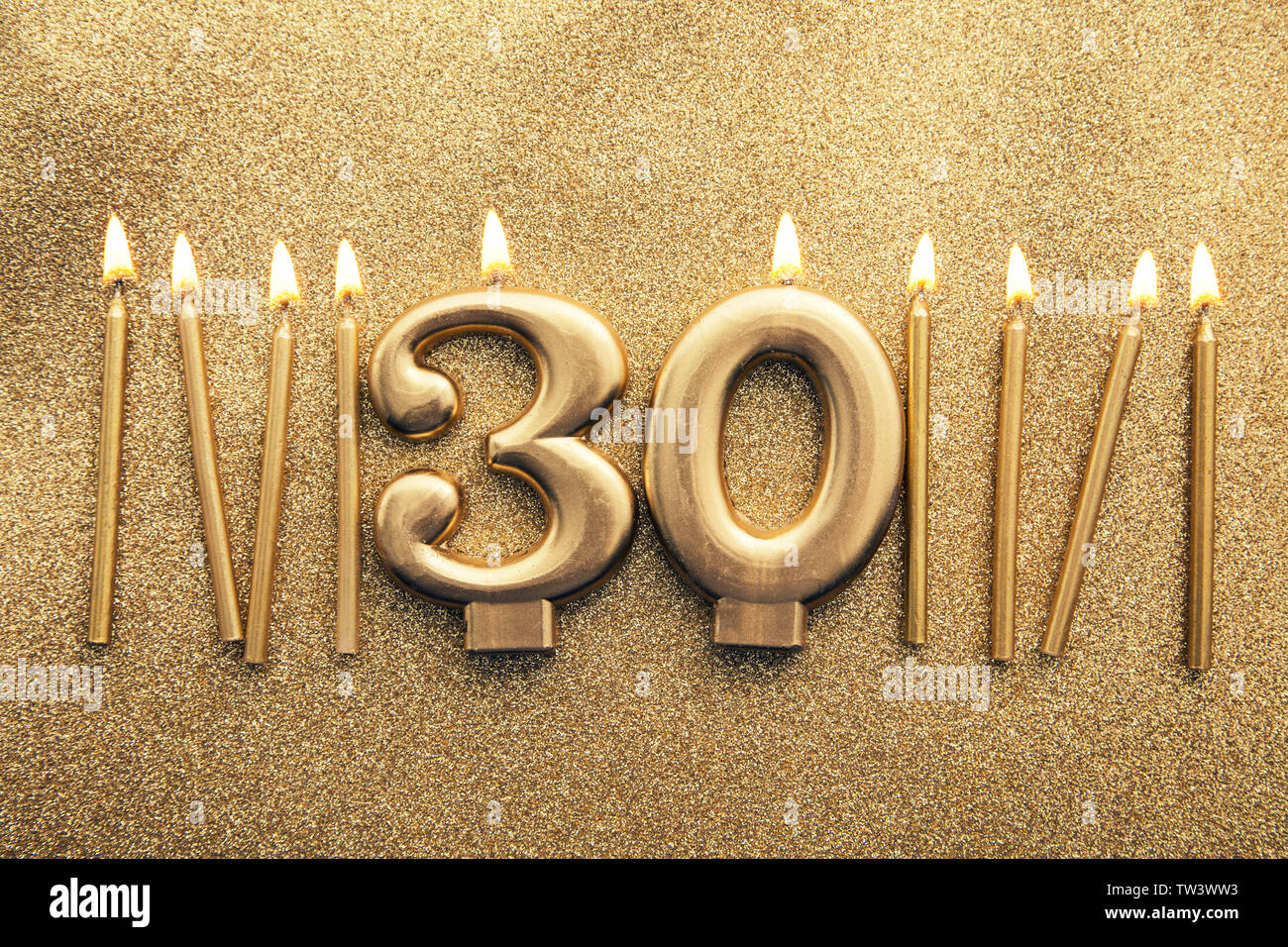 Number 30 gold celebration candle on a glitter background Stock Photo ...