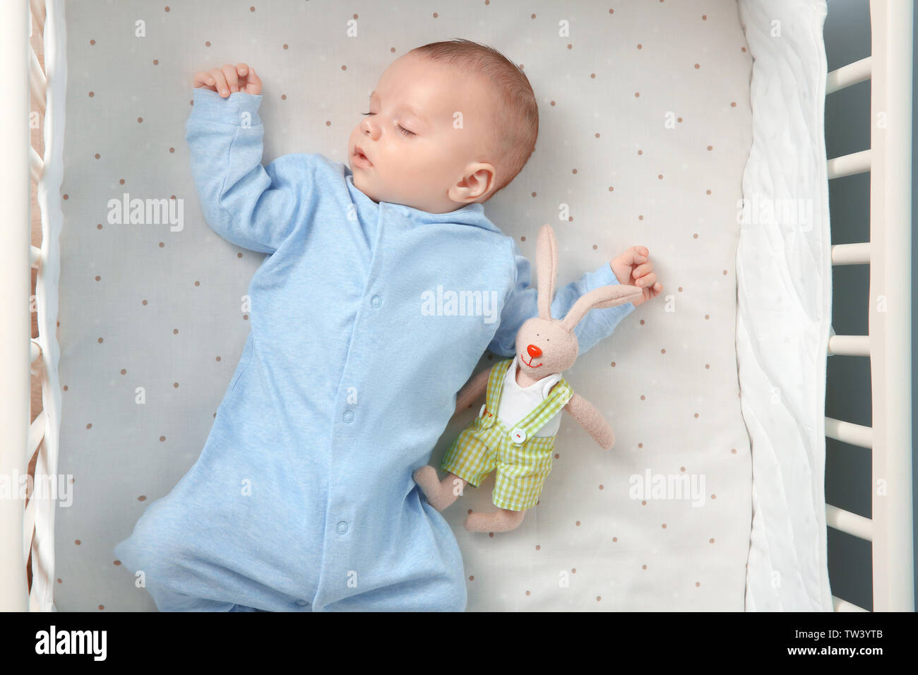 Cute little baby with toy sleeping in cradle at home Stock Photo - Alamy
