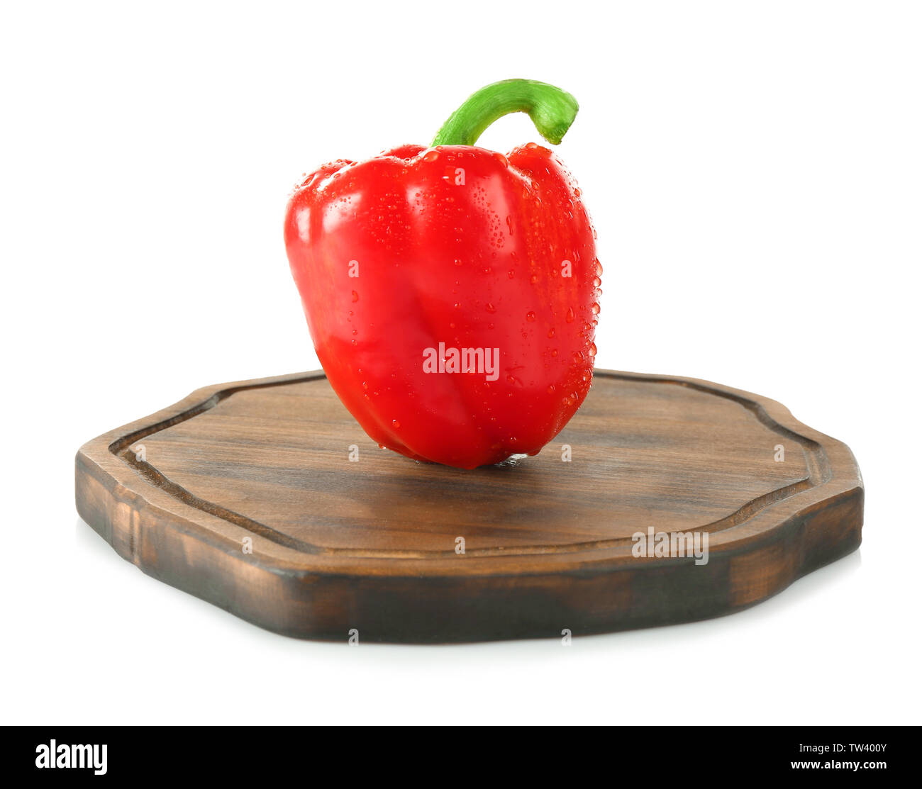 Wooden board with bell pepper isolated on white Stock Photo - Alamy