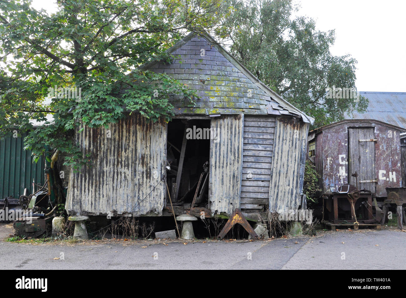 Old farm grain store on staddle stones.Wood and corrugated iron ...