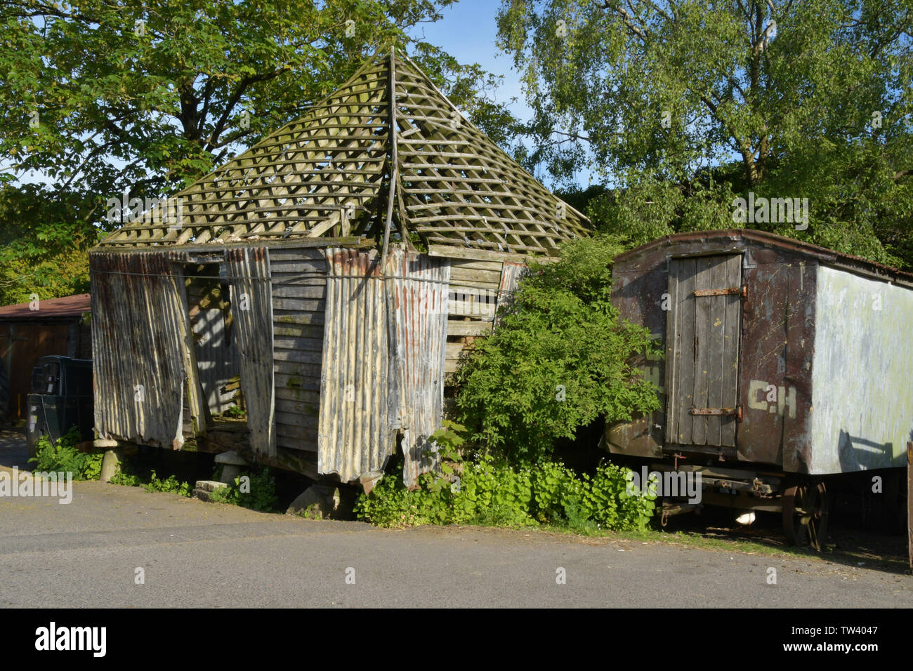 Old farm grain store on staddle stones.Wood and corrugated iron ...