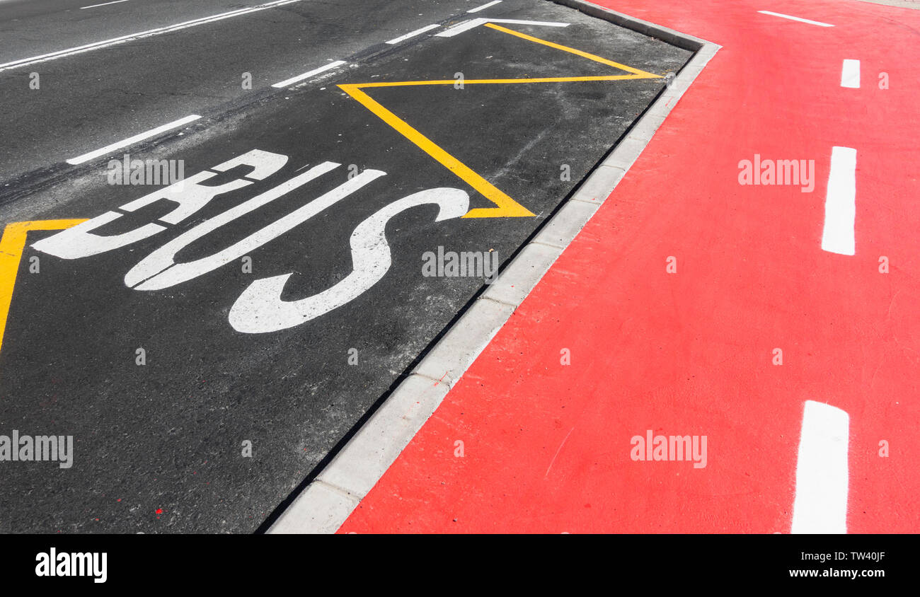 Painted bike, cycle path/lane next to bus stop in Spain Stock Photo - Alamy