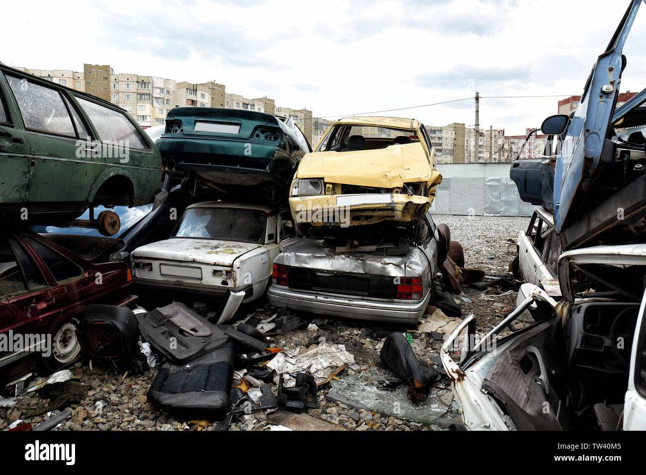 Piled crushed cars on salvage yard Stock Photo - Alamy