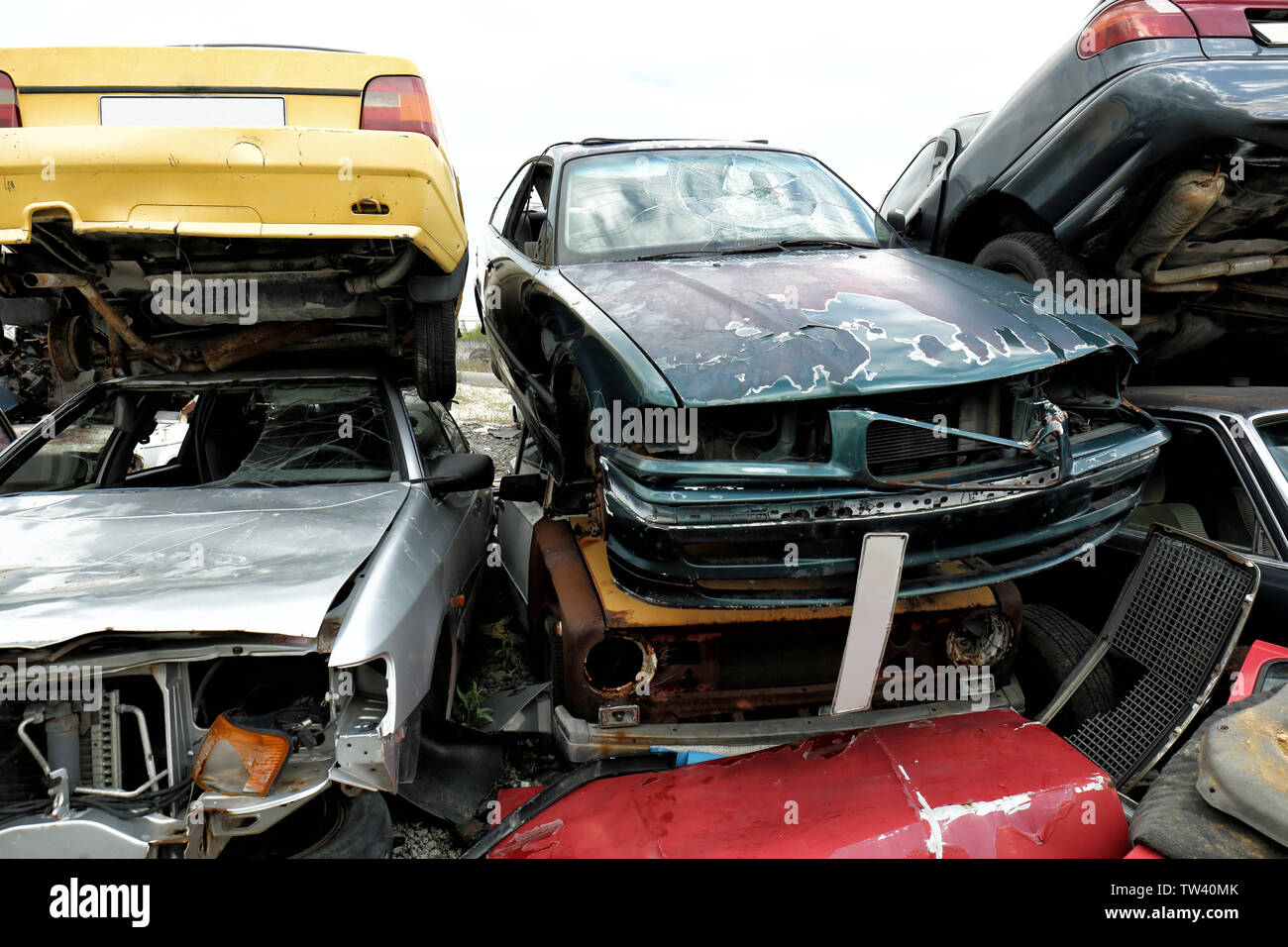 Piled crushed cars on salvage yard Stock Photo - Alamy