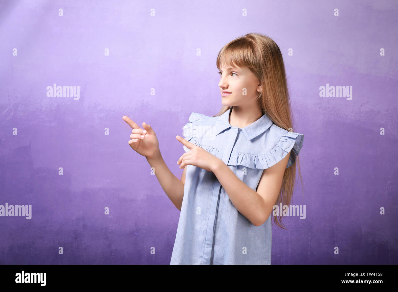 Pretty little girl on color background Stock Photo - Alamy