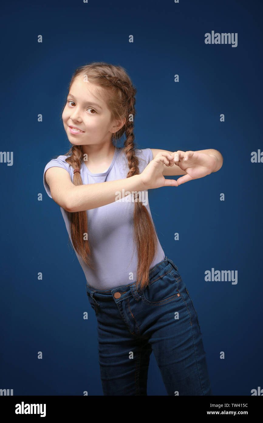 Cute funny girl on color background Stock Photo - Alamy