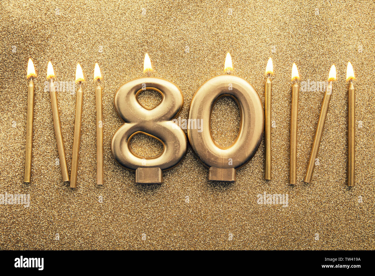 Number 80 gold celebration candle on a glitter background Stock Photo ...