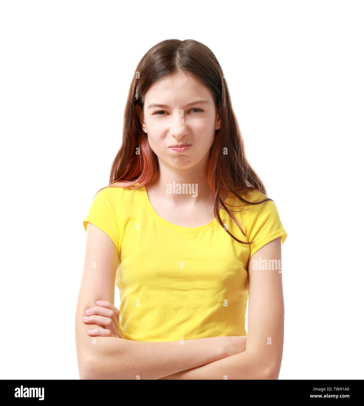 Cute angry girl on white background Stock Photo - Alamy
