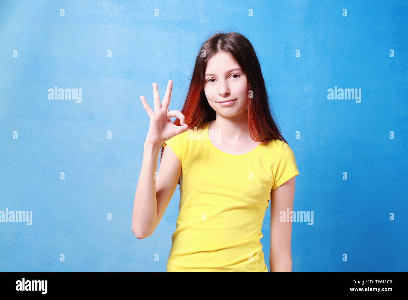 Cute pretty girl on color background Stock Photo - Alamy