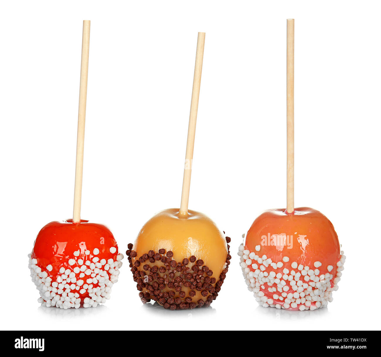 Delicious candy apples on white background Stock Photo - Alamy