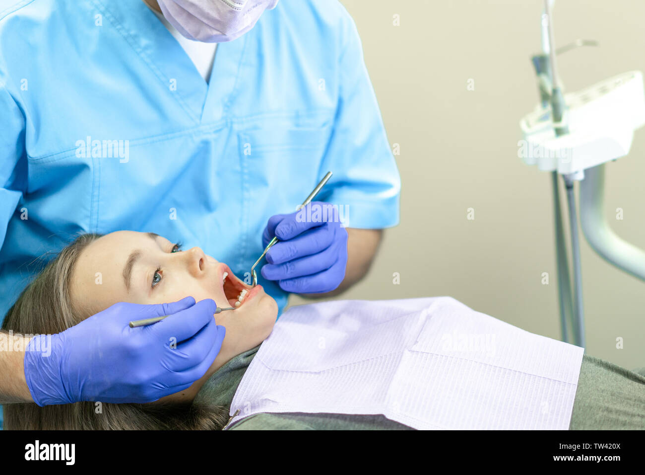 Dental clinic. Reception, examination of the patient. Teeth care. Young ...