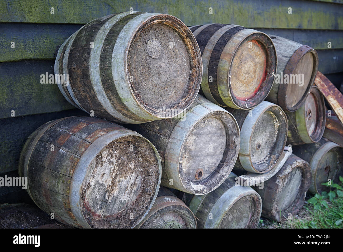 Stacked wooden barrels on backyard Stock Photo - Alamy