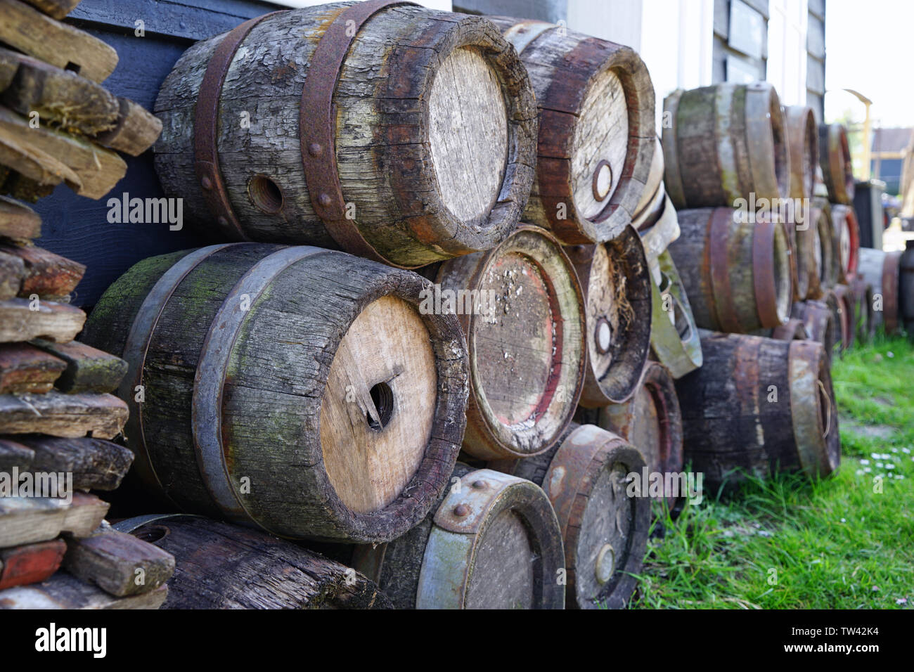 Stacked wooden barrels on backyard Stock Photo - Alamy