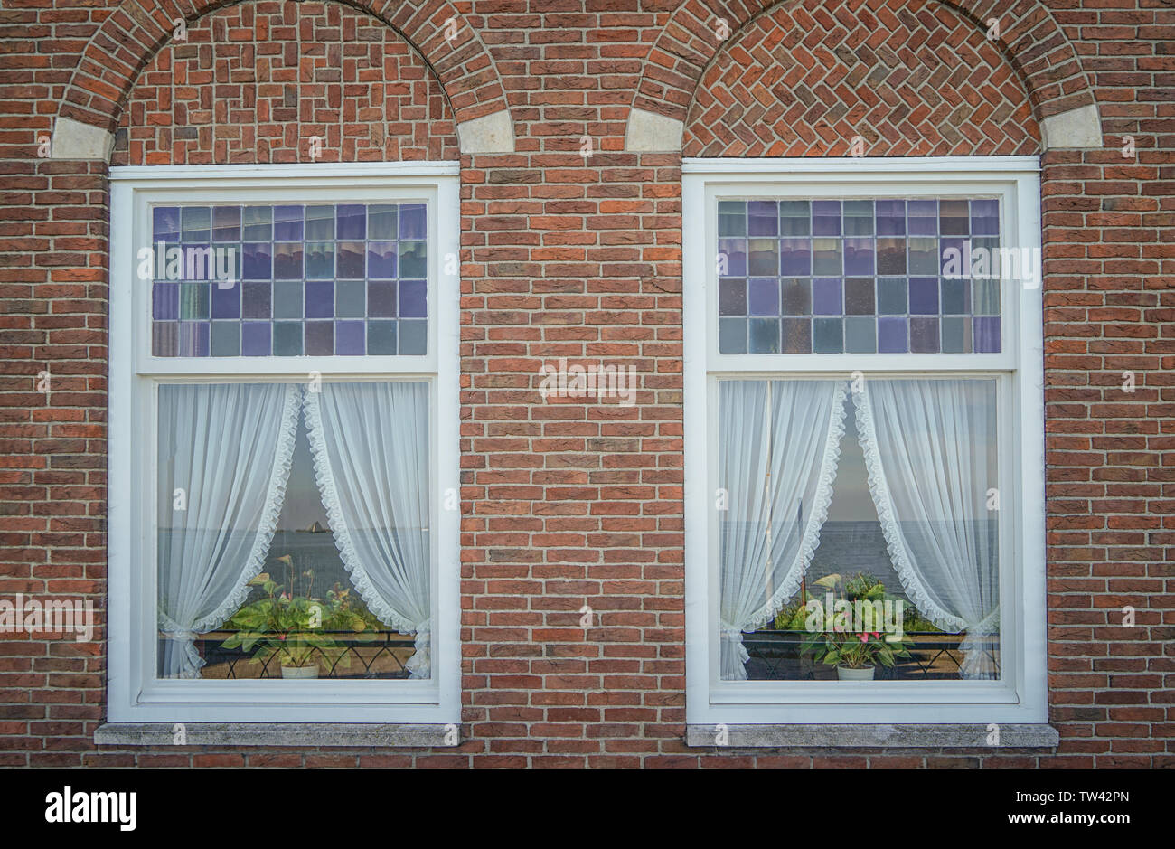 Building with modern windows Stock Photo - Alamy