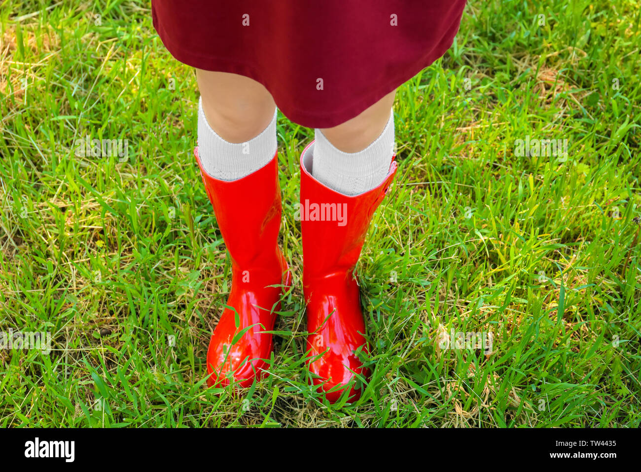 Young woman in red wellington boots outdoors Stock Photo - Alamy