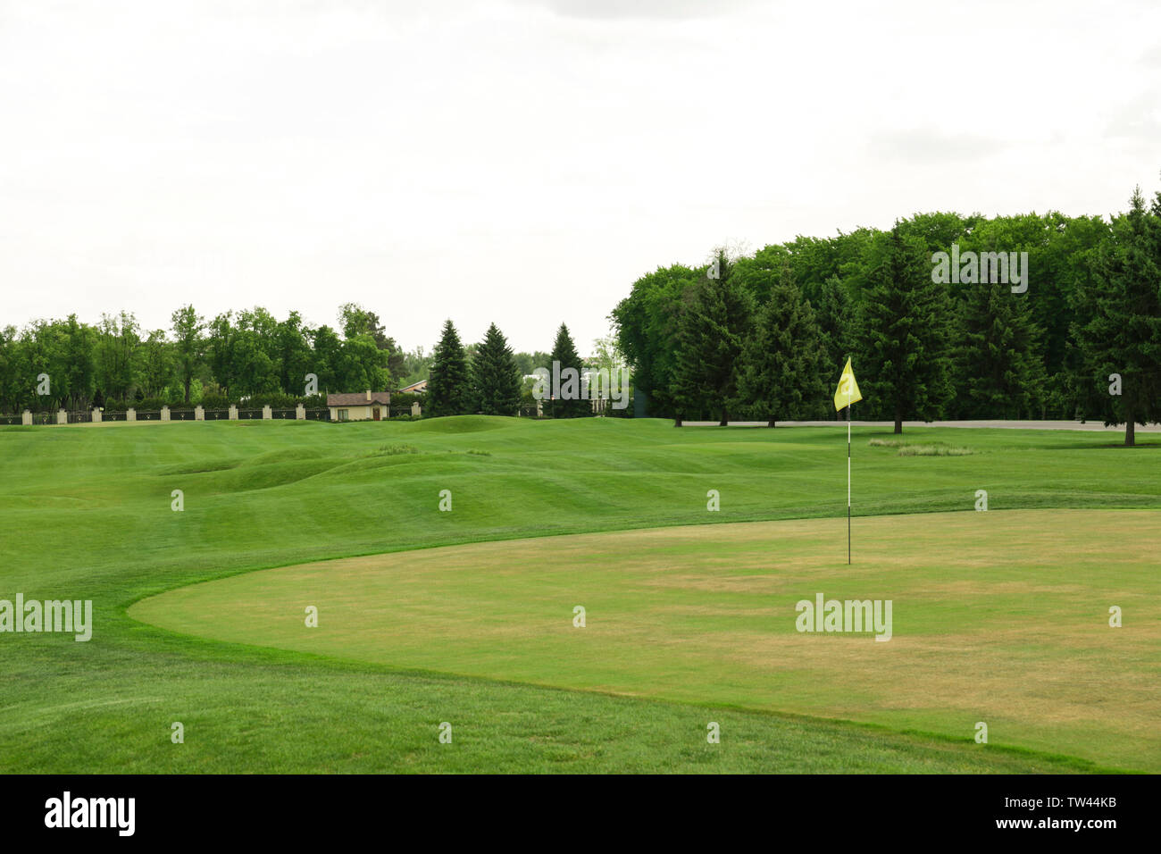 Landscape with big golf course on summer day Stock Photo - Alamy