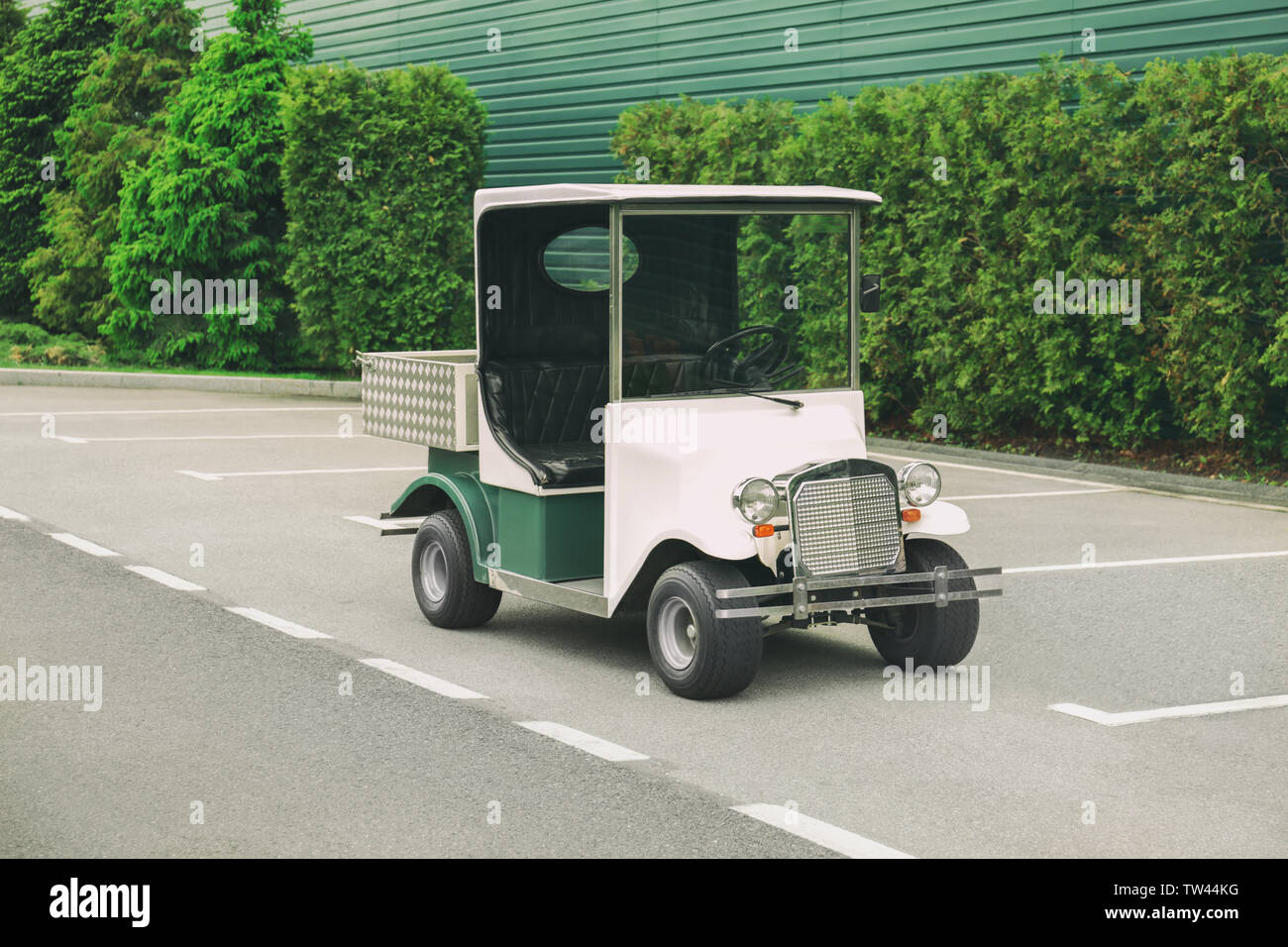 Modern cart on road in golf club Stock Photo - Alamy